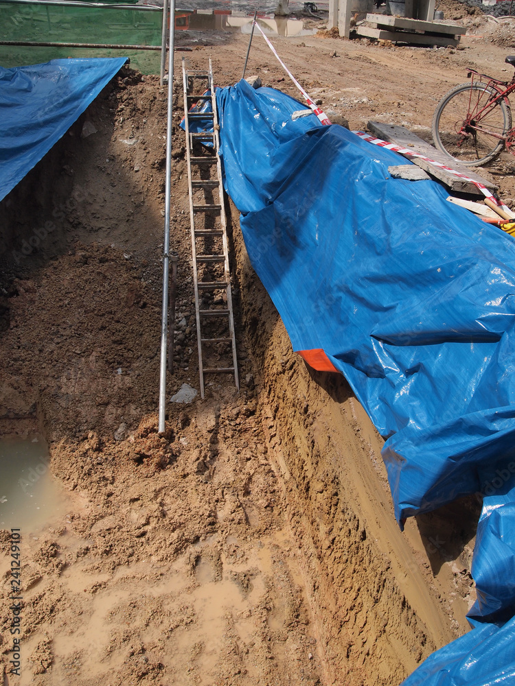 Temporary slope protection using huge plastic sheet at the construction ...