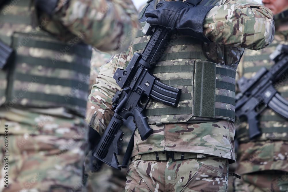 Romanian special forces soldiers, armed with M4A1 5.56×45mm NATO ...