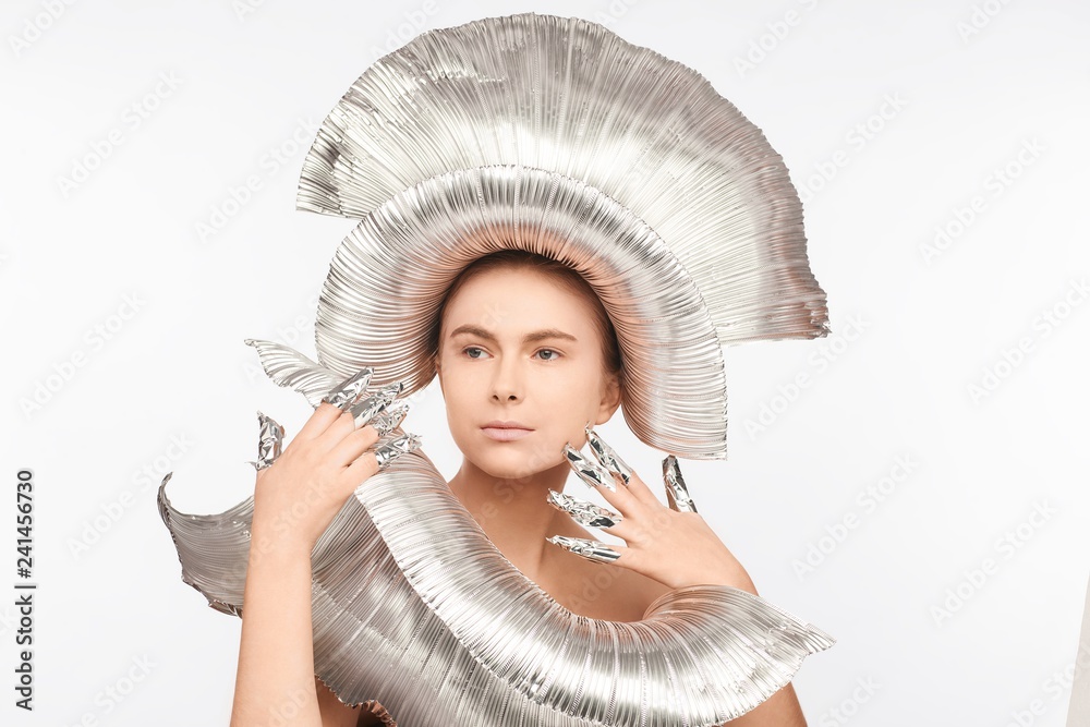 Beautiful woman in a futuristic style, with an iron hat and clothes and ...