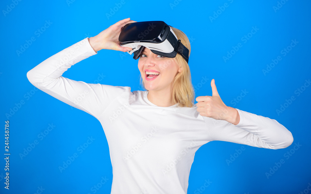 Amazed young woman touching the air during the VR experience. Woman ...