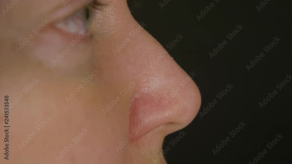 Female face, eyes and nose profile view. Male face and nose on black ...