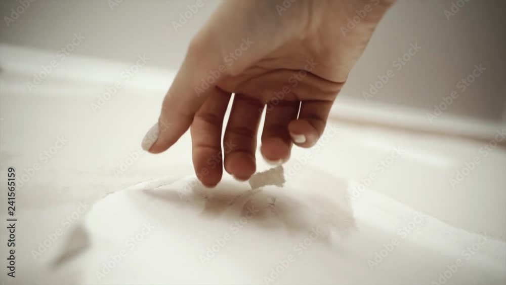 Woman hand scraping off wallpaper from walls. Removing wallpapers in ...