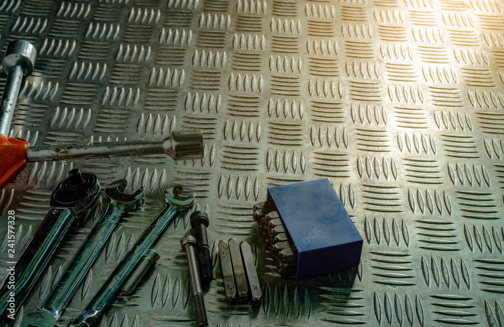 Top view of tools on industrial metal checker plate. Metal checkerplate ...