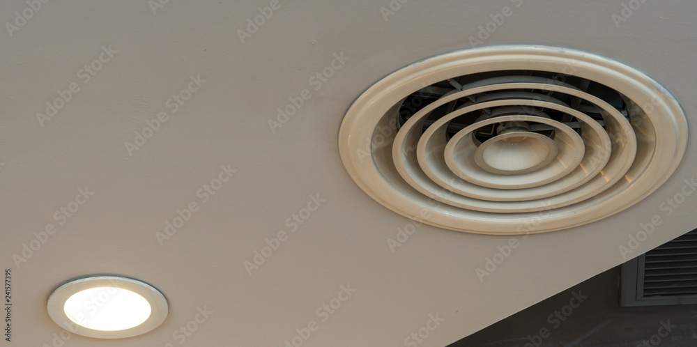 Air duct on ceiling in the mall or hospital. Air conditioner install on ...