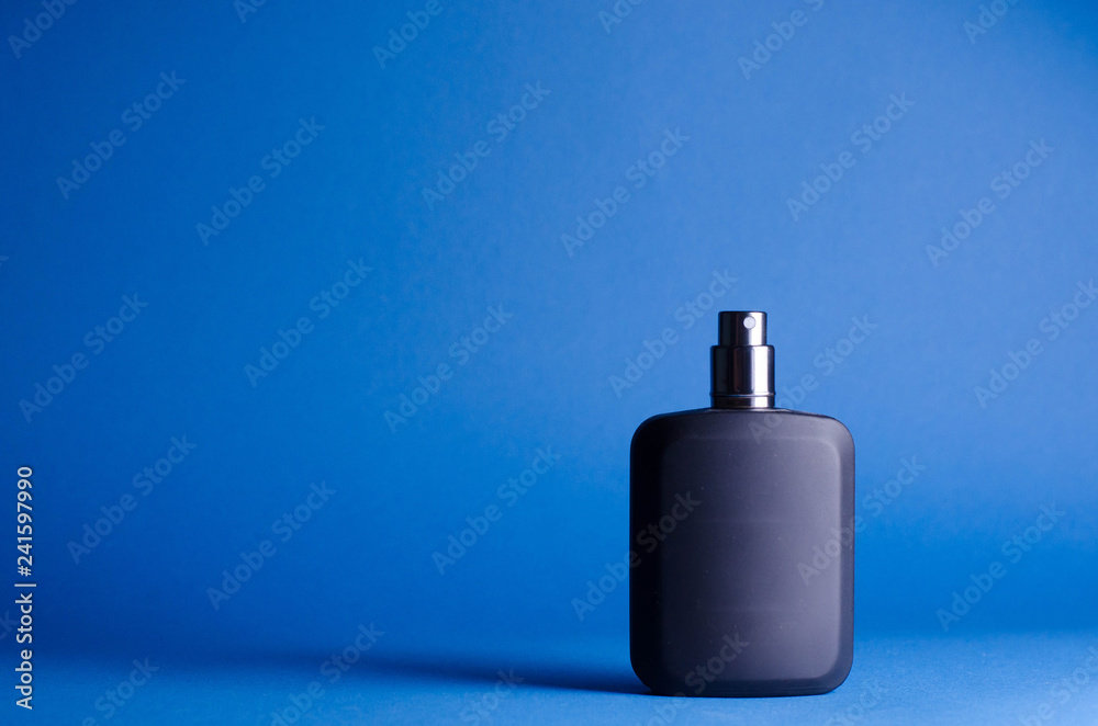 perfumes on a blue background Stock Photo | Adobe Stock