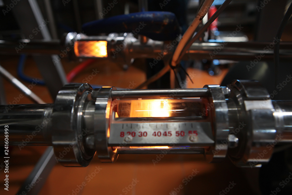 Equipment at the brewery. Huge tanks with temperature sensors. Pressure ...