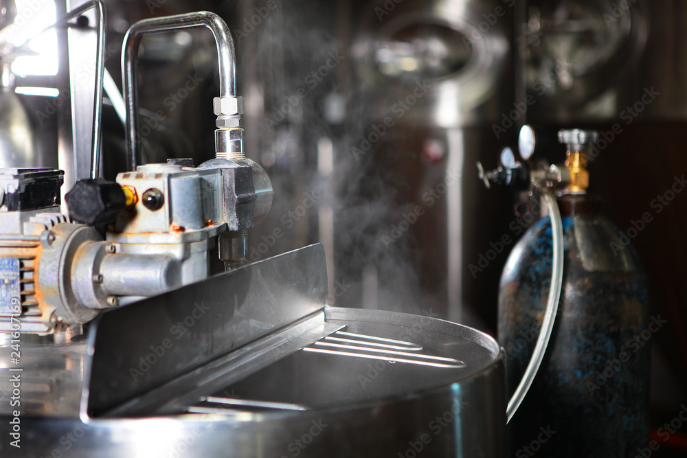 Zdjęcie Stock: Equipment at the brewery. Huge tanks with temperature ...