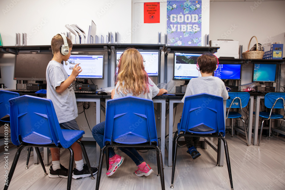 Children using computers at school Stock Photo | Adobe Stock