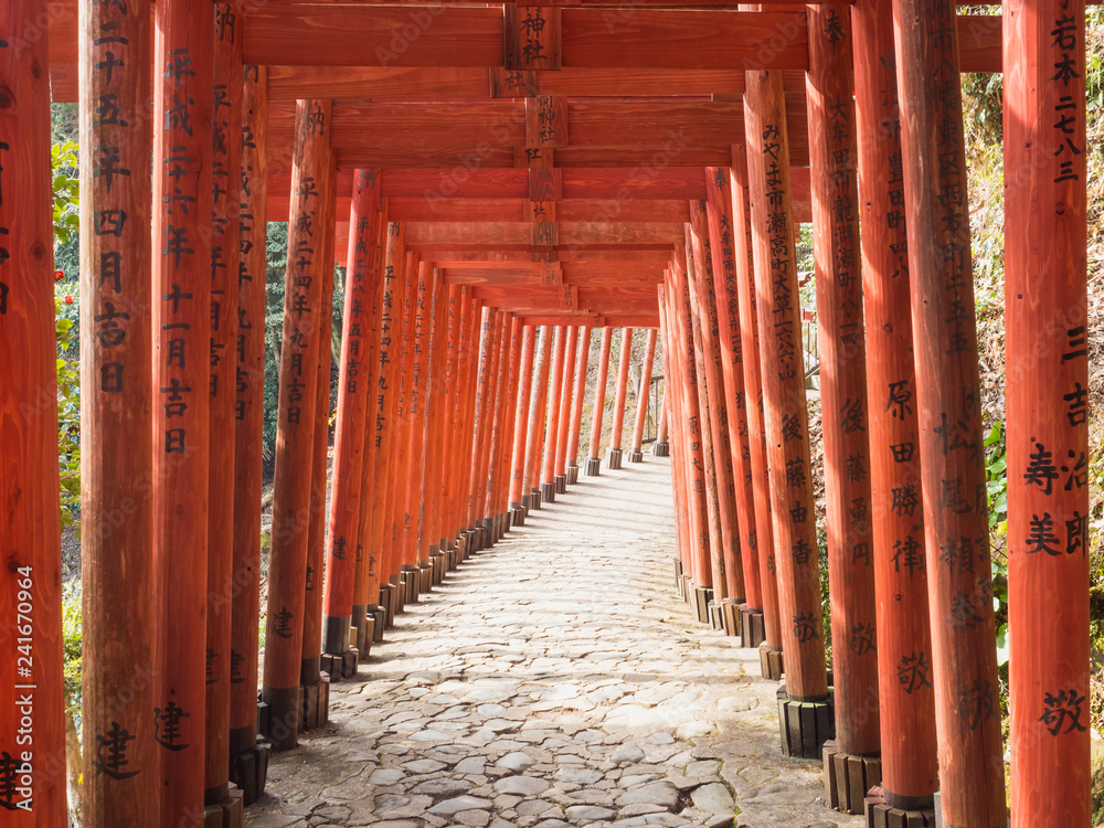 January 2018. Red torii in Yūtoku Inari Shrine. Torii with names of ...