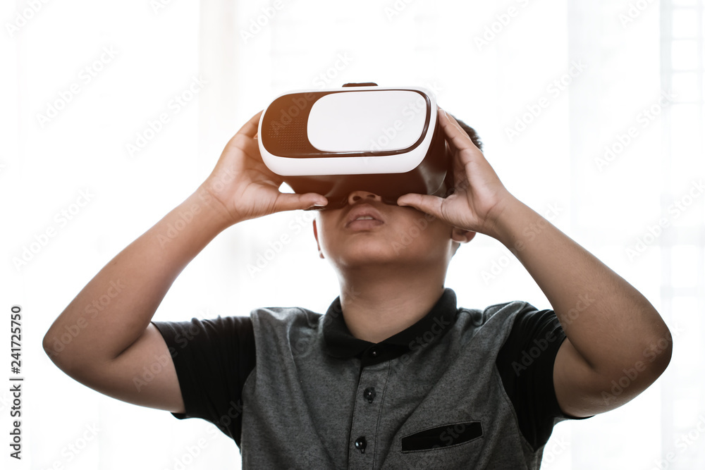 Virtual reality interaction headset by Asian student wearing vr box ...