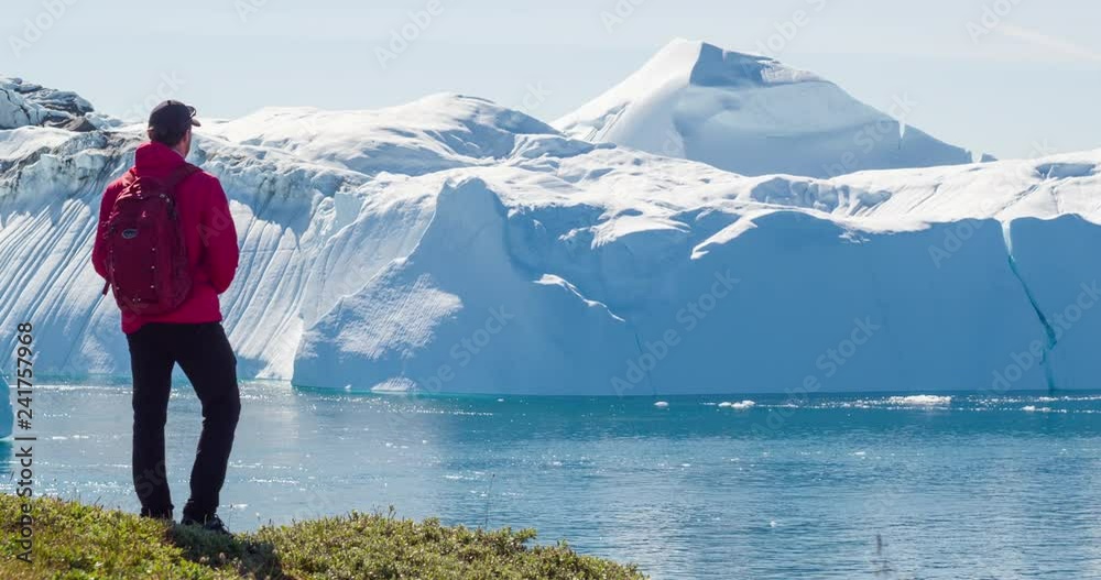 Travel in arctic landscape nature with icebergs - Greenland tourist man ...