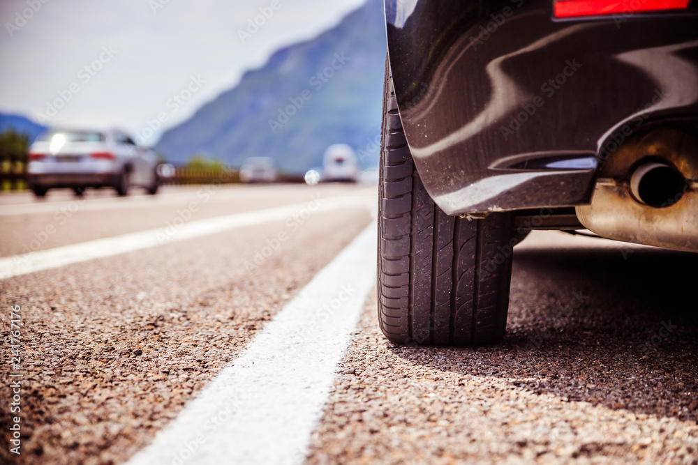 Tyre of a car on the emergency lane, breakdown on the highway. Copy ...