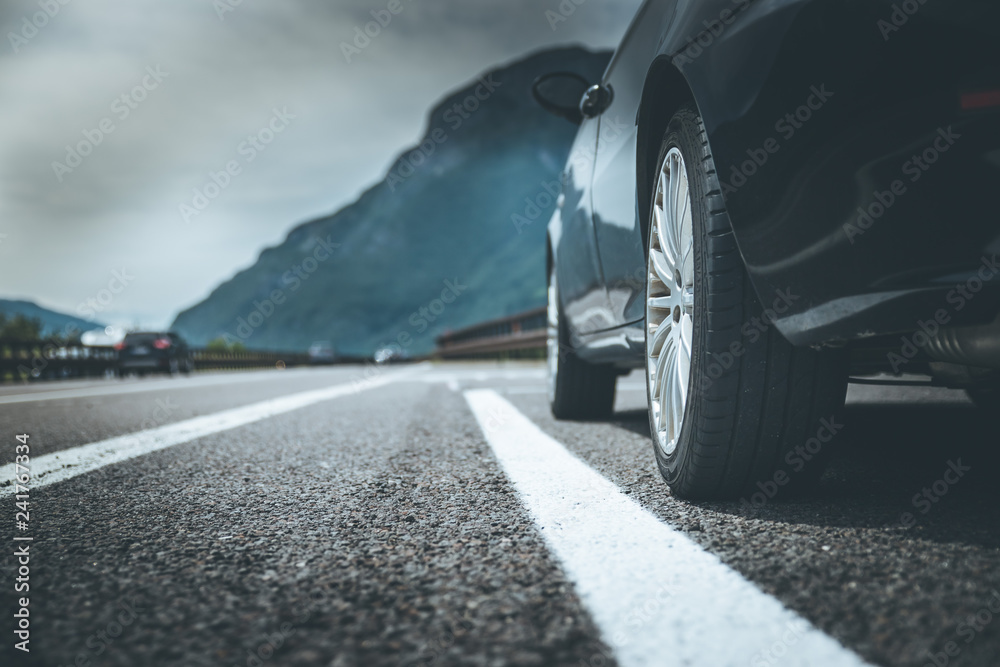 Tyre of a car on the emergency lane, breakdown on the highway. Copy ...