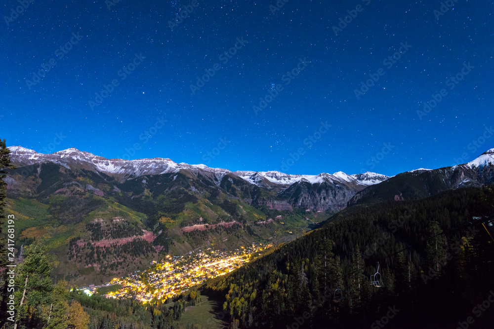 The glowing lights of the town of Telluride Colorado underneath the ...