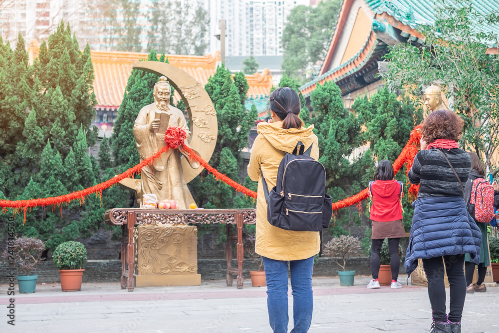 woman ties red rope and pray at Yue Lao (God of marriage) in Wong Tai ...