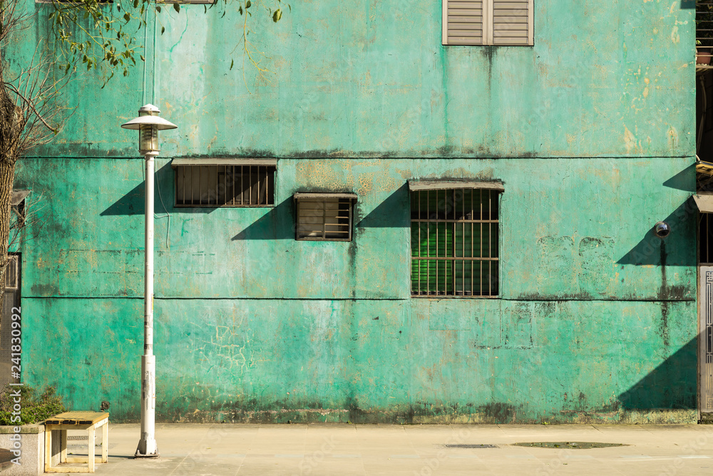 Architecture green wall with windows and sunlight cast shadow Stock ...