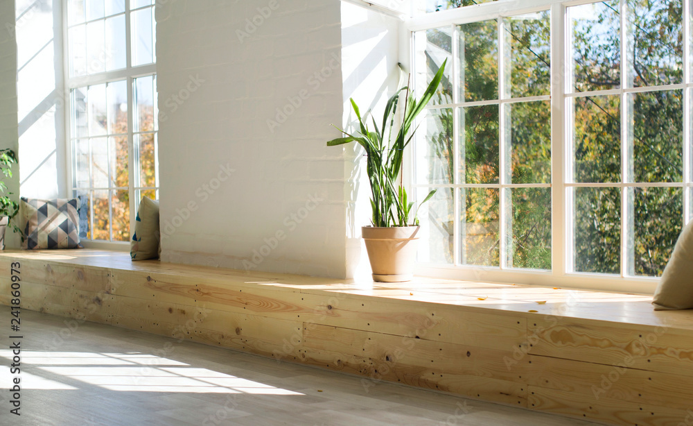 Bright photo studio interior with big window, high ceiling, wooden ...