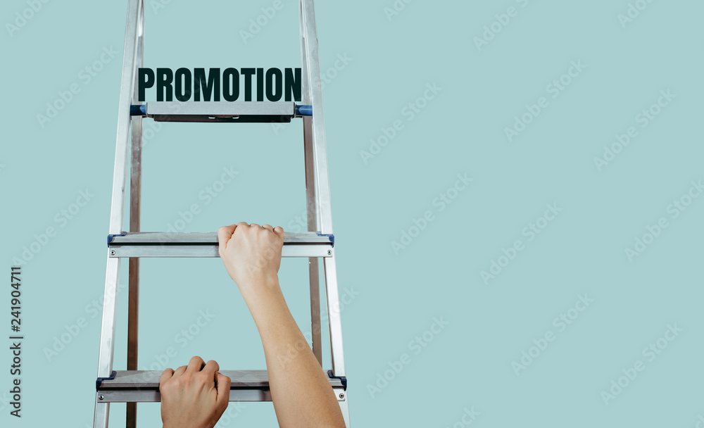 Hands climb the ladder, at the top PROMOTION sign. The hard way to ...
