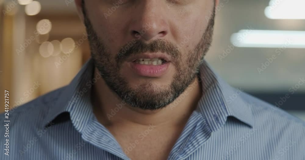 Vidéo Stock Portrait of stressed hispanic businessman looking at camera ...