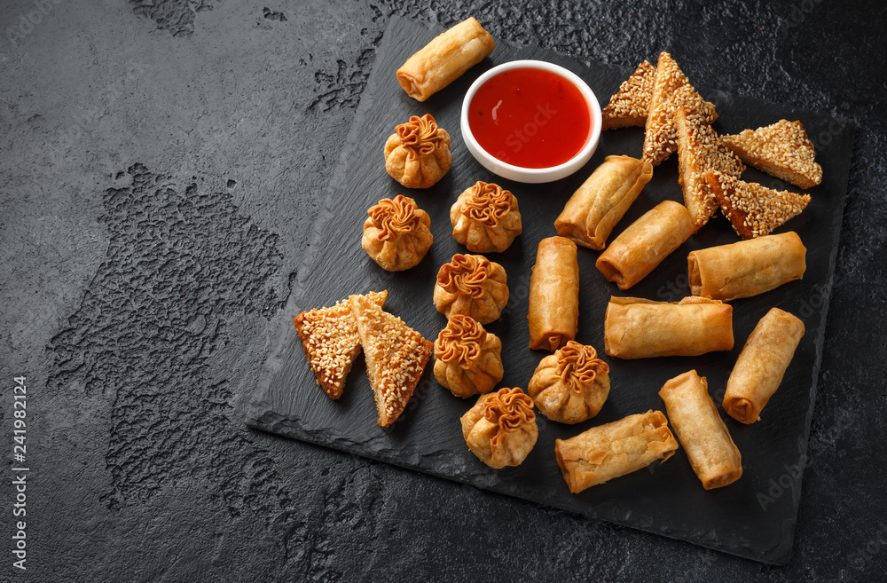 Crispy Chicken wontons, vegetable spring rolls and prawn toasts with ...
