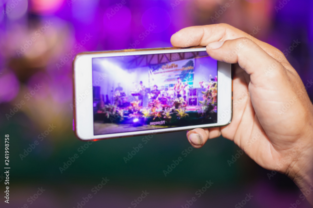 Hands use smartphones record small music concert live streaming video ...