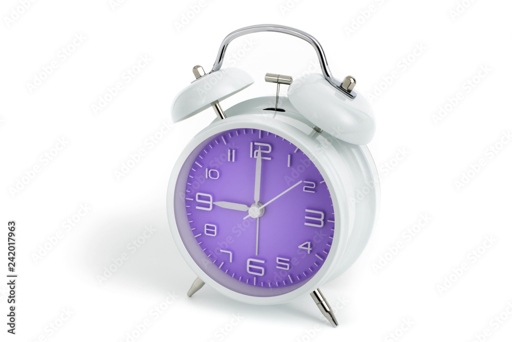 Twin bells analogue alarm clock with purple clock face shows nine o ...