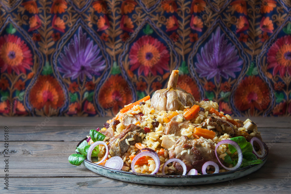 Uzbek plov a rice dish prepared with lamb, stewed with fried onions ...