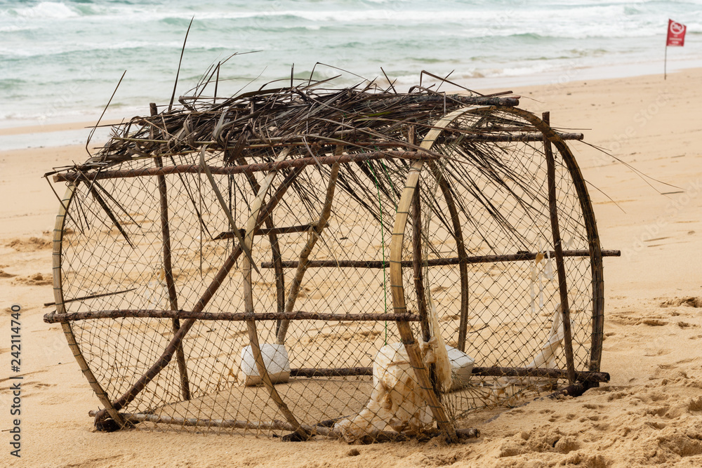 Crab Trap on a beach in Thailand, sand, ocean, seaб waves Stock Photo ...