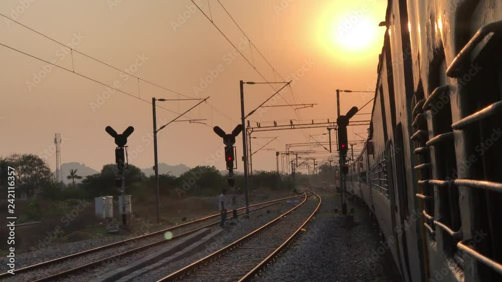 Stockvideo Sunset: passenger journey train rides in Indian Railways ...
