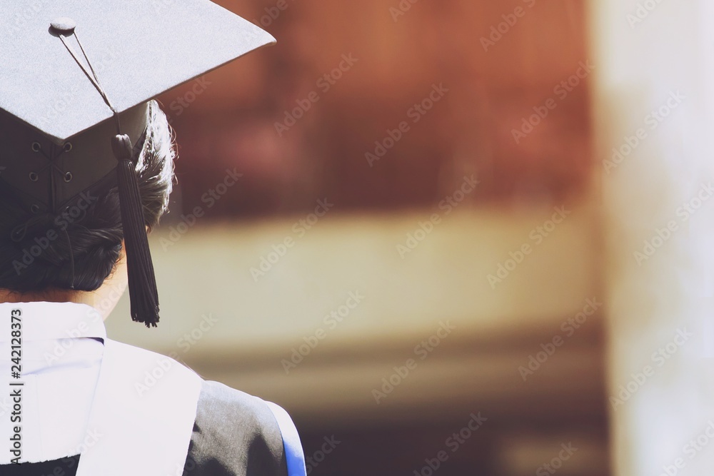 shot back side young female of graduation hats during commencement ...