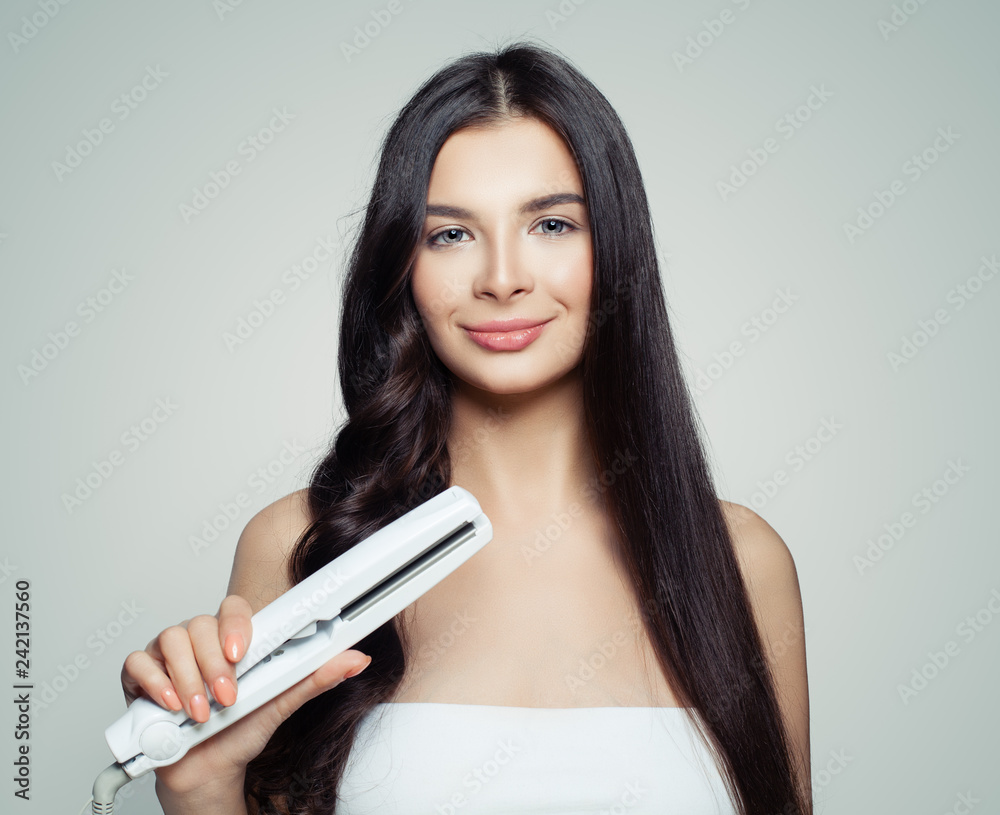 Beautiful woman with straight hair and curly hair using hair ...