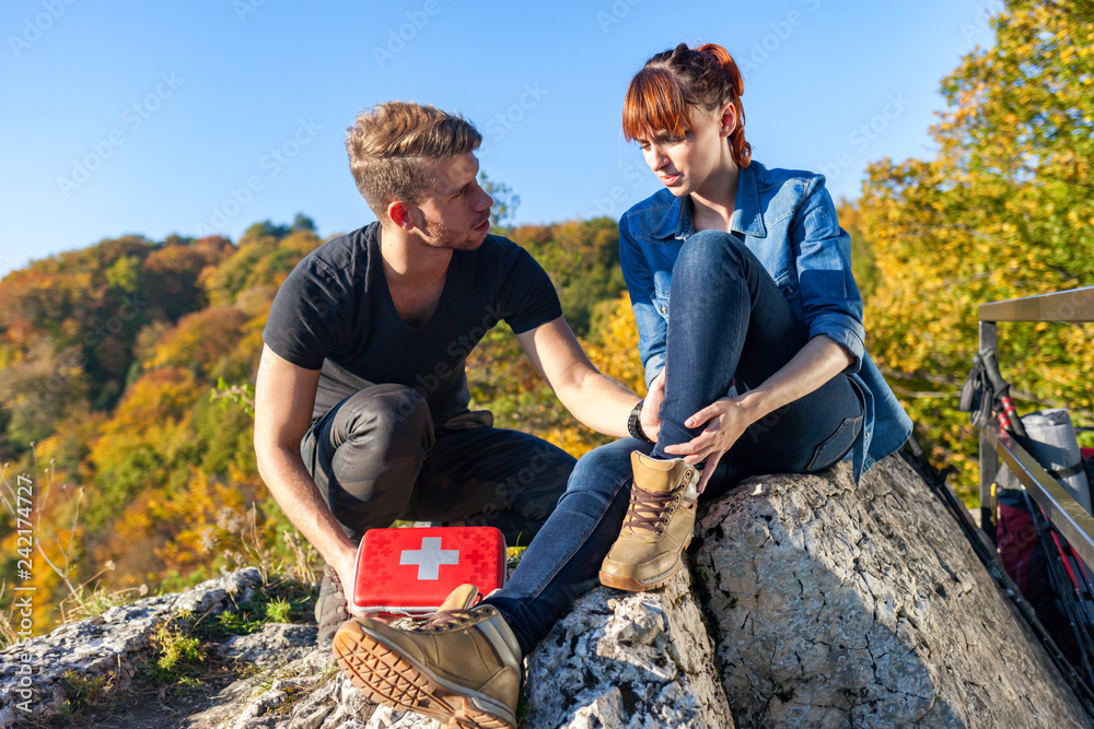 Ankle sprained, woman suffering from injury while trekking and she ...