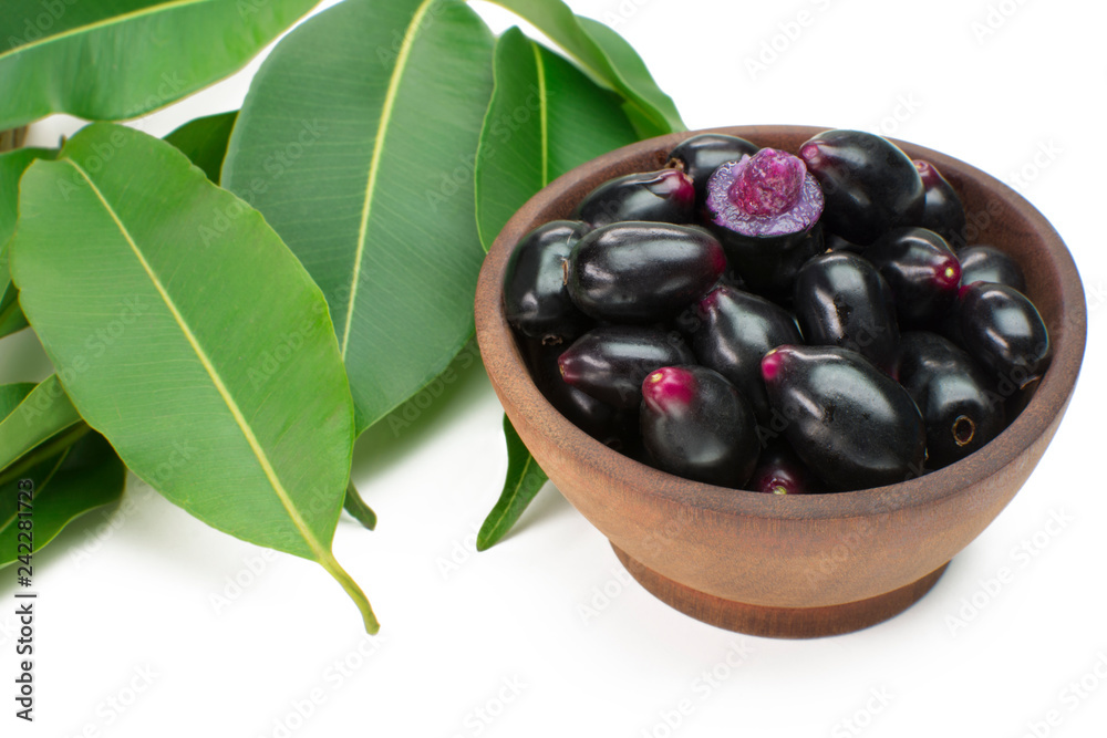 Exotic fruit Syzygium cumini called in Brazil as jamelão in wood bowl ...