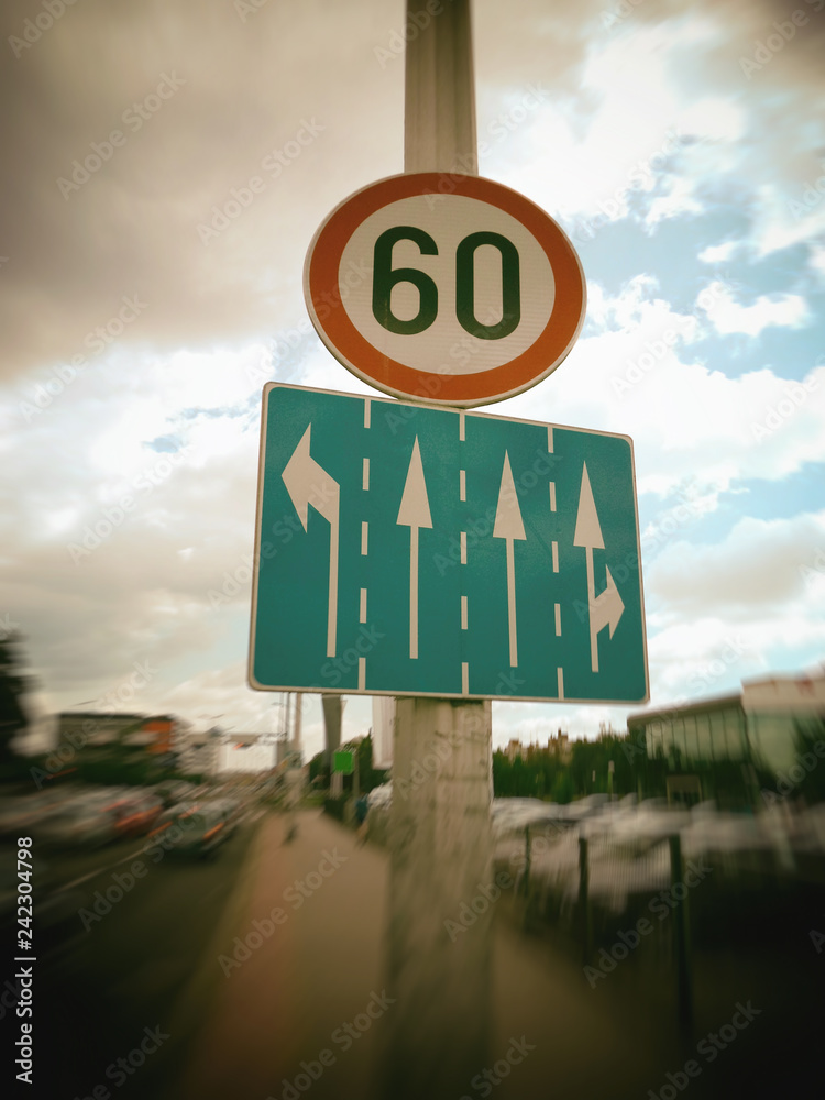 Traffic sign for realignment of vehicles, permissible speed, blurred ...