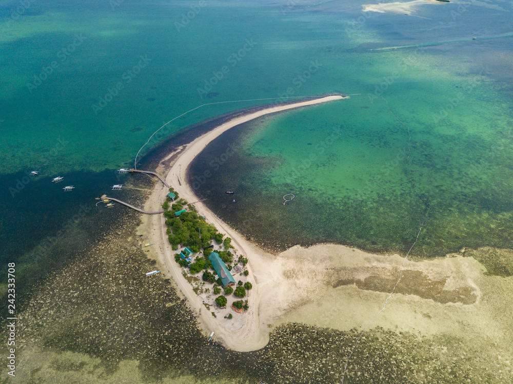 Aerial view of curved beach of Pontod virgin island located near ...