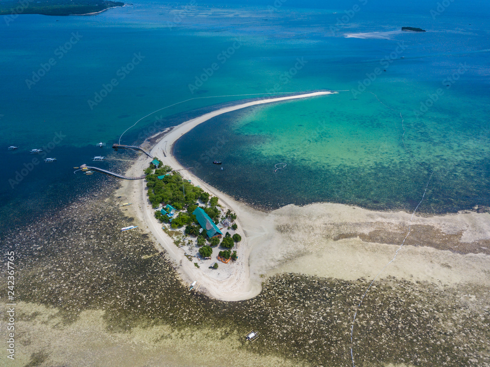 Aerial view of curved beach of Pontod virgin island located near ...