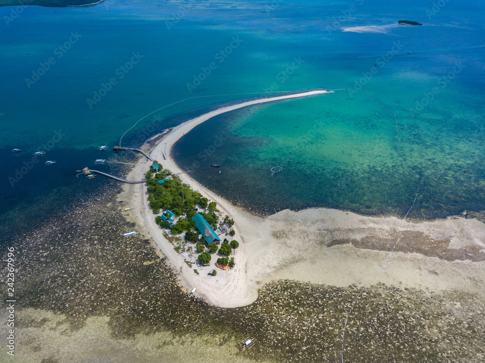 Aerial view of curved beach of Pontod virgin island located near ...