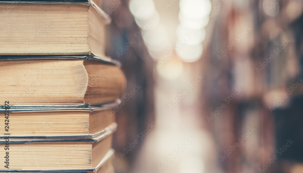 Book stack in library study room with old bookshelf for business and ...