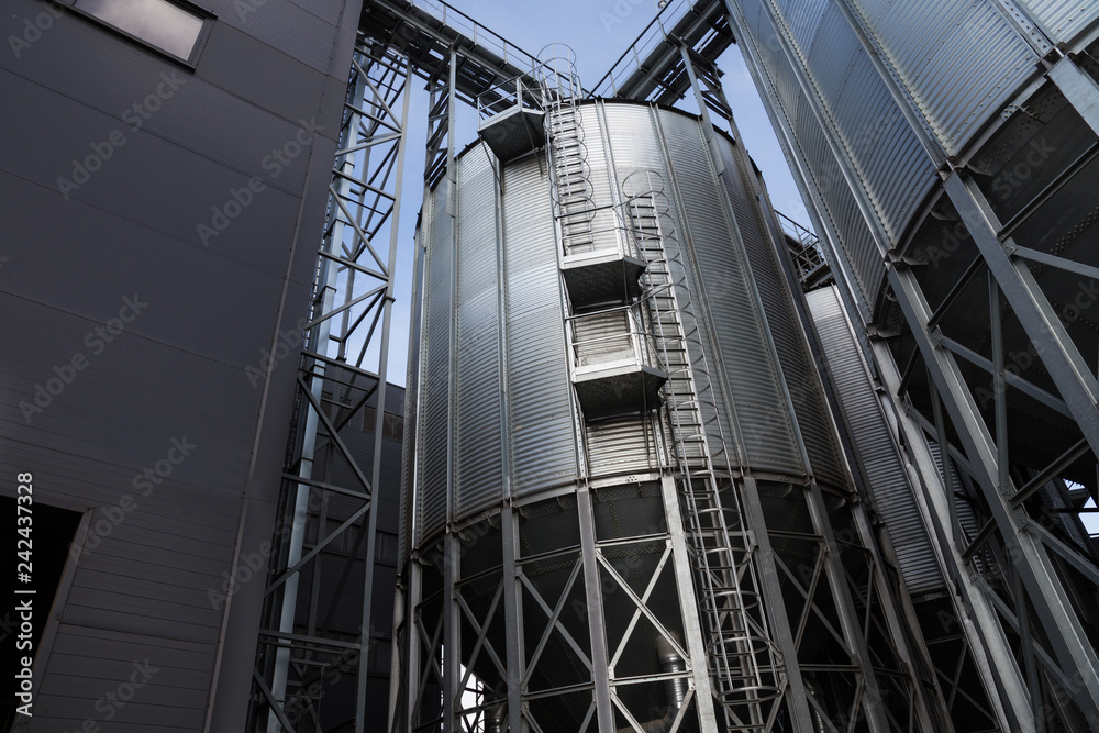 Exterior of Agricultural Silo building with storage tanks for ...