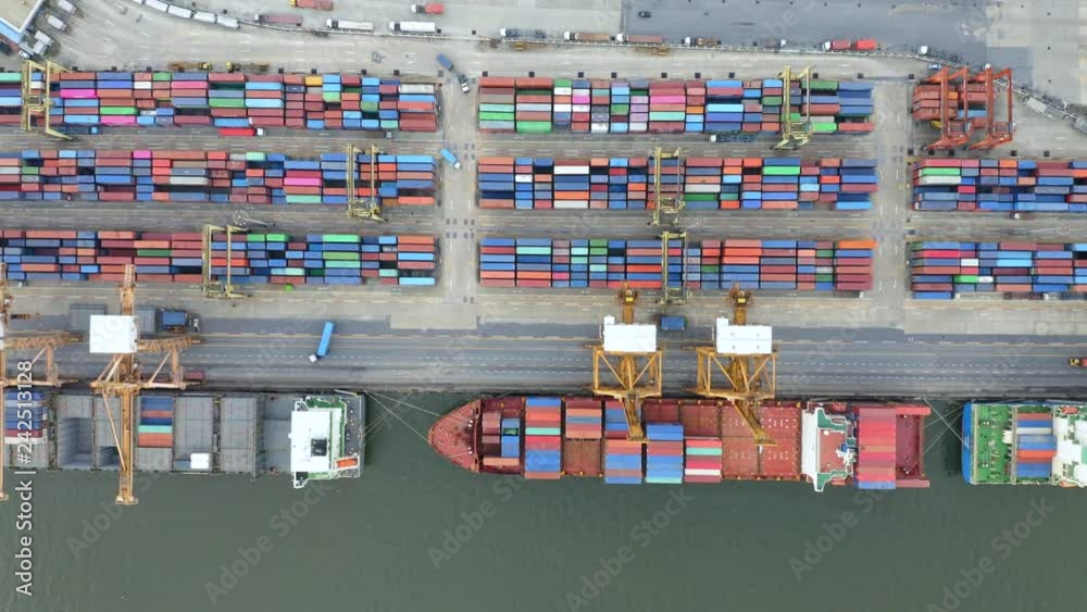 Container Cargo freight ship with working crane loading bridge in ...