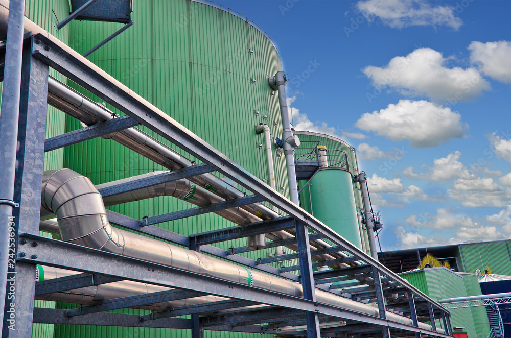 Biogas tanks on a biogas plant. Wastes recycling ecology concept. Green ...