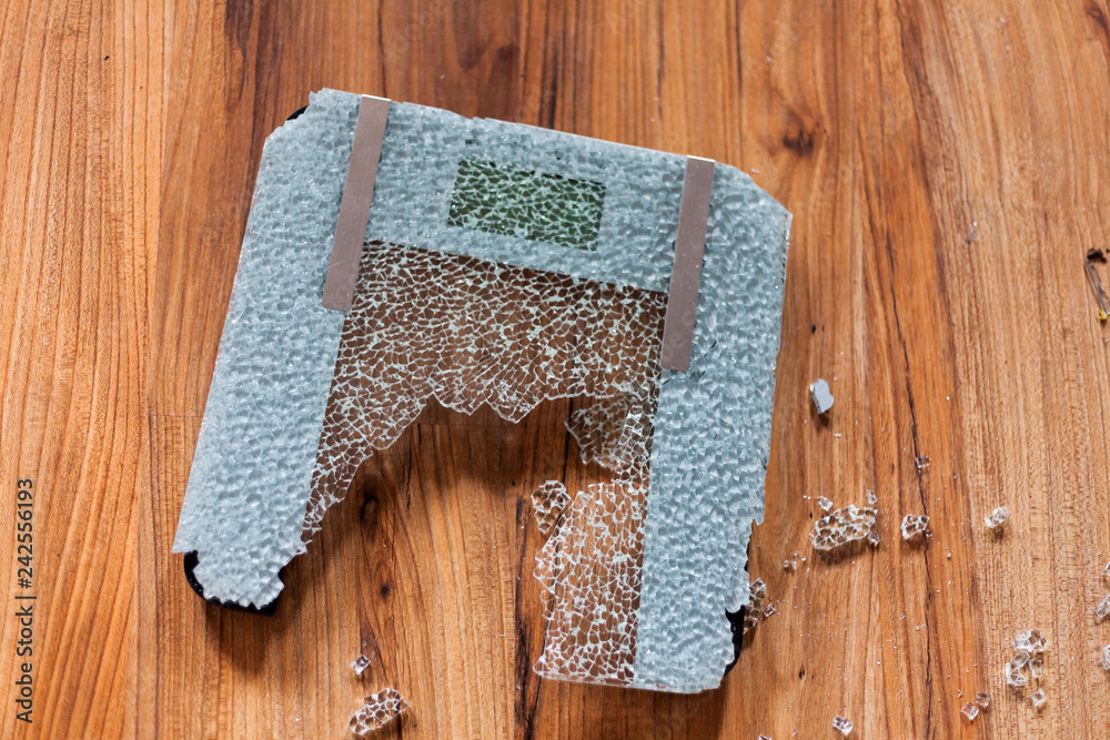 Broken digital human scale on the floor. Broken glassy digital scale ...