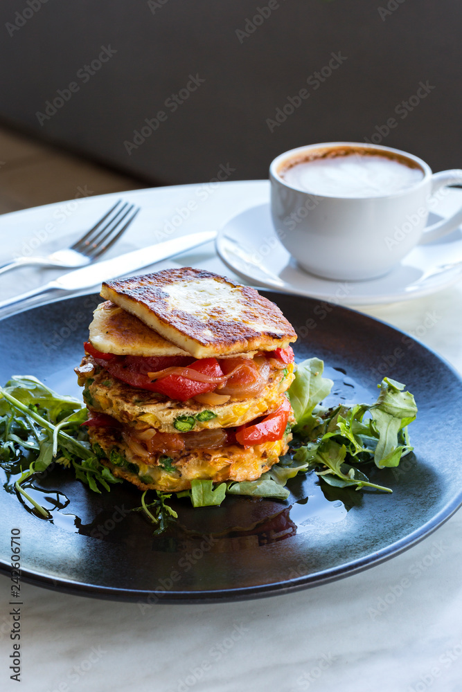 Image of Italian Cuisine breakfast featuring a vegetable fritter stack ...