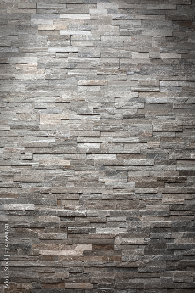 Steinwand Hintergrund mit Steinriemchen Ziegel Mauer Rustikal Dunkel Grau Stock-Foto | Adobe Stock
