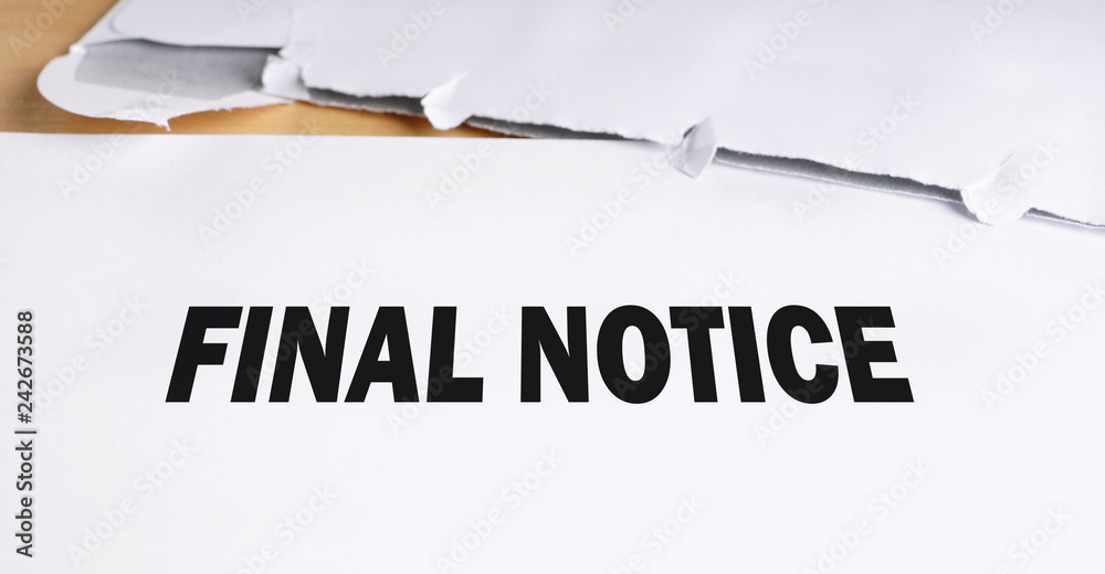 final notice. letter and opened envelope on desk Stock Photo | Adobe Stock