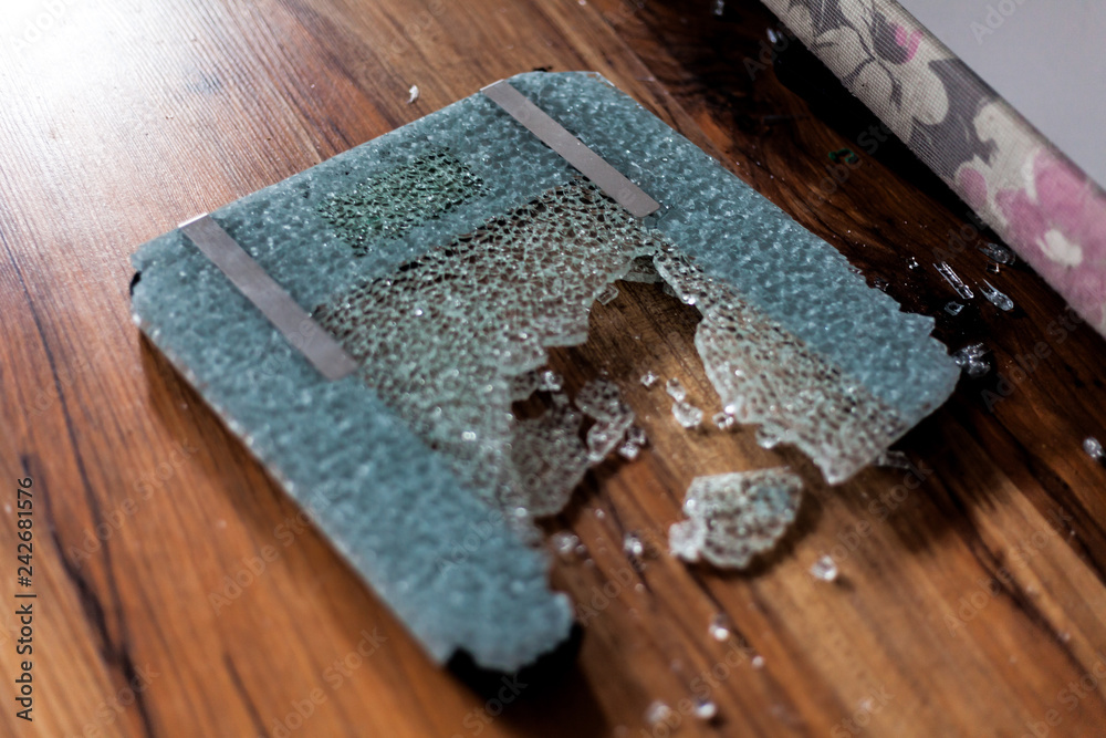 Broken digital human scale on the floor. Broken glassy digital scale ...