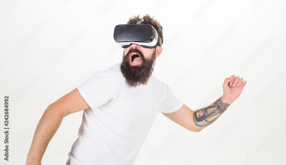Guy with head mounted display interact virtual reality. Virtual activity. Hipster play virtual ...
