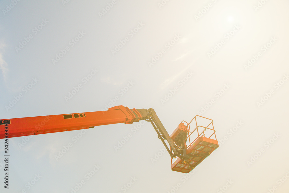 Red bucket crane mounted on truck.Truck mounted Articulating boom lift ...