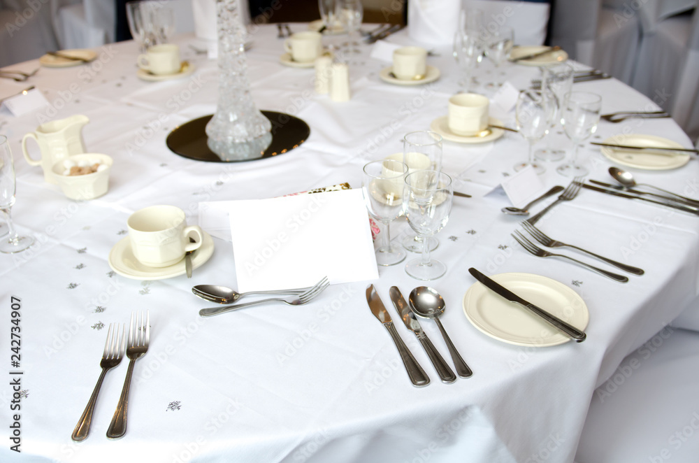 An empty blank paper table card name plate sign on a wedding table ...