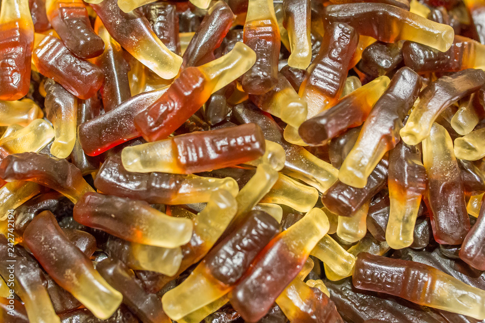 Jelly-candy texture, cola flavor, shape of cola bottles. Stock Photo ...